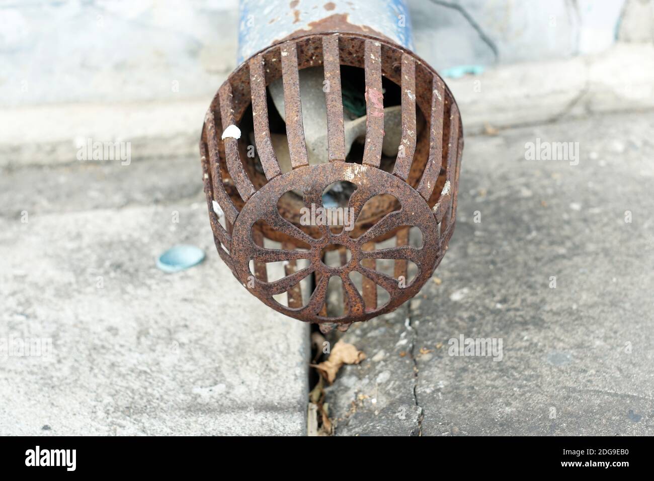 Close-UP a vintage head of a suction pump have very rust on the cement ...