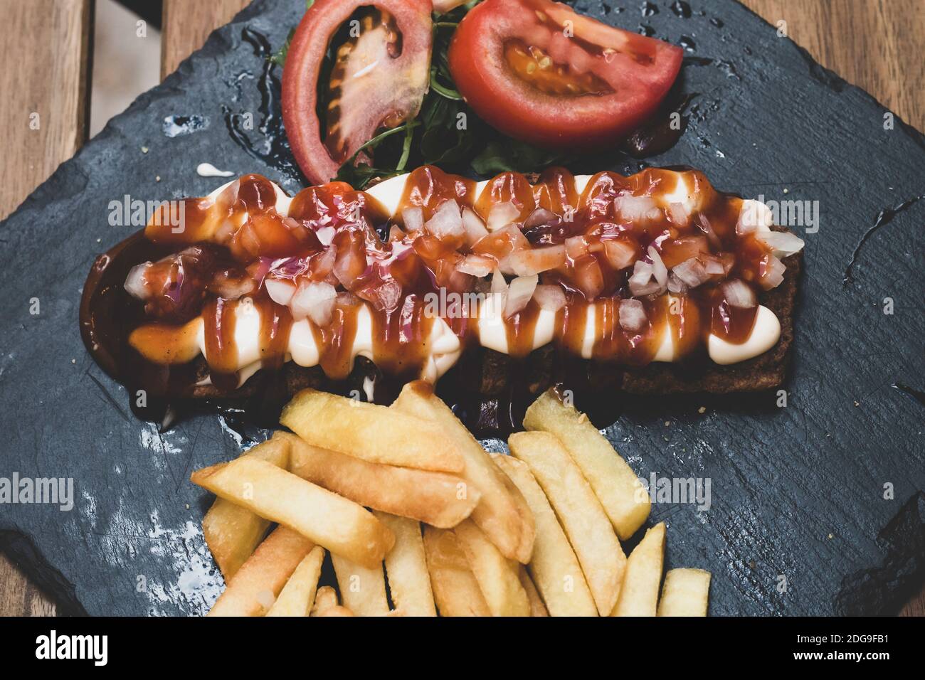 a mix of american fast food, junkie food. A fried meat like hamburger ...