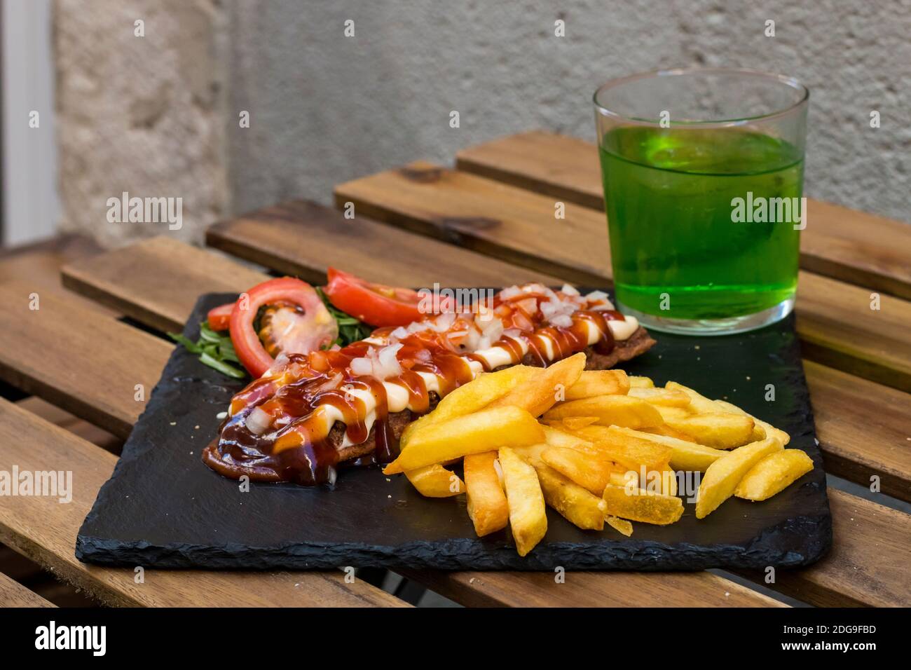 a mix of american fast food, junkie food. A fried meat like hamburger ...