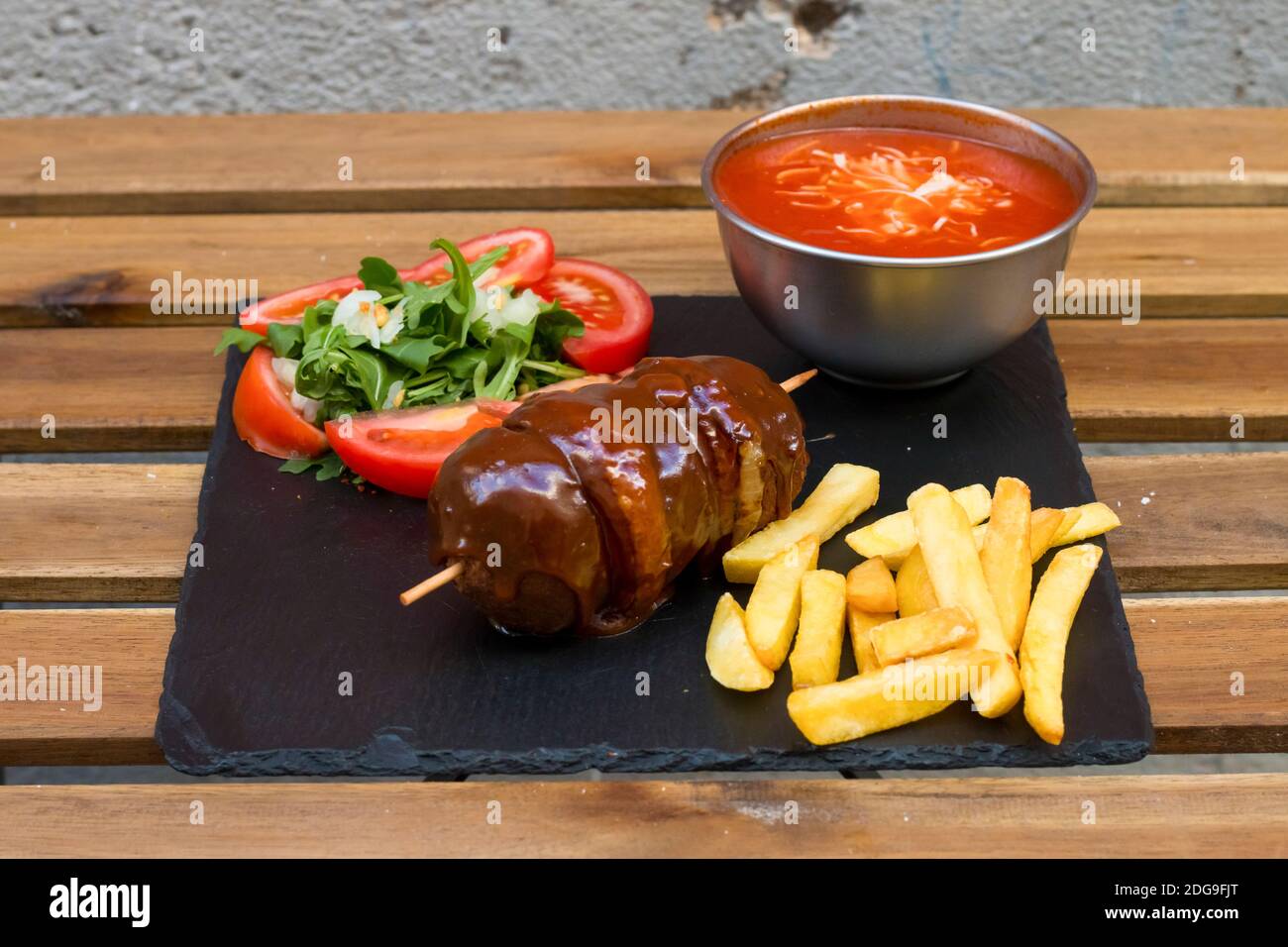 a mix of american fast food, junkie food. A fried meat like hamburger ...