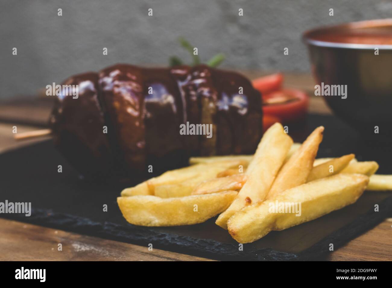 a mix of american fast food, junkie food. A fried meat like hamburger ...