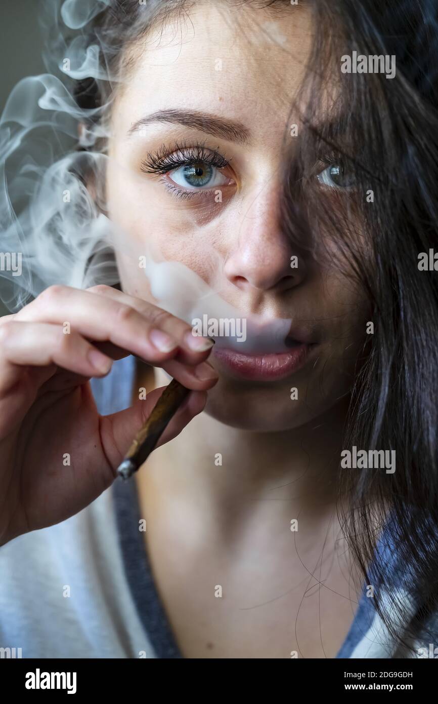 Brunette smoking cigarette hi-res stock photography and images - Alamy