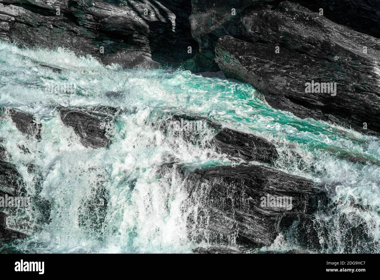 Wild and fast moving river rapids white water rushing over rugged ...
