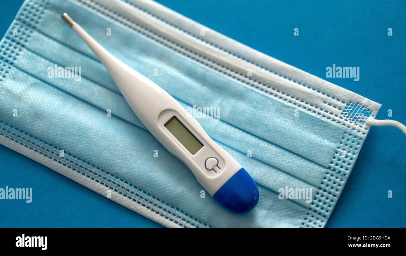 Top view of digital hand temperature scanner with removal surgical face ...