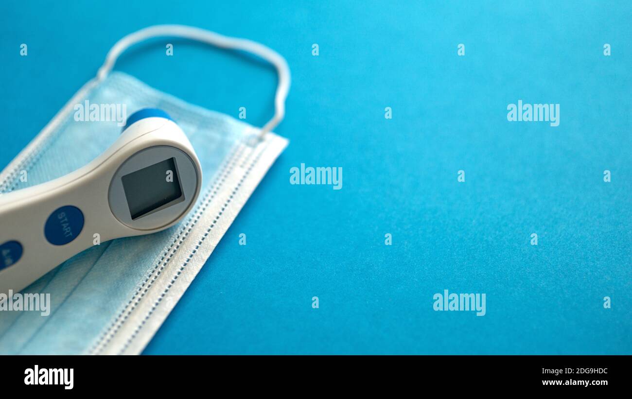 Top view of digital hand temperature scanner with removal surgical face ...