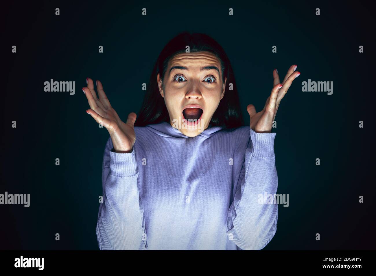 Screaming. Portrait of young crazy scared and shocked caucasian woman ...