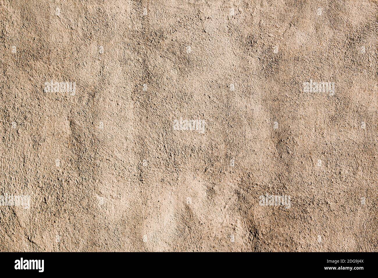 Beige colored abstract wall texture background in different shades of ...