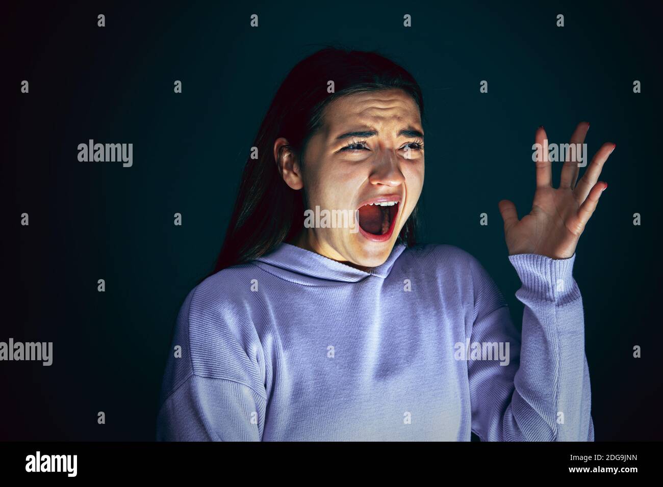 Ready to run. Portrait of young crazy scared and shocked caucasian ...