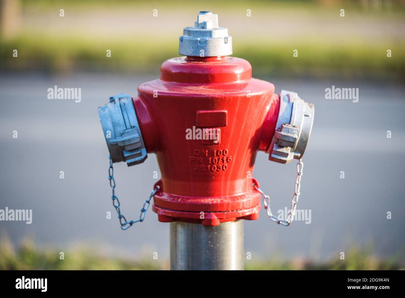 Red Fire hidrant for emergency fire access Stock Photo - Alamy