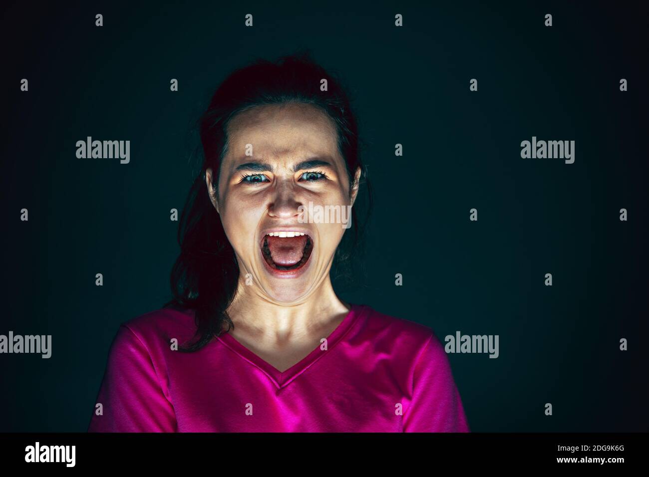 Scream. Portrait of young crazy scared and shocked caucasian woman ...