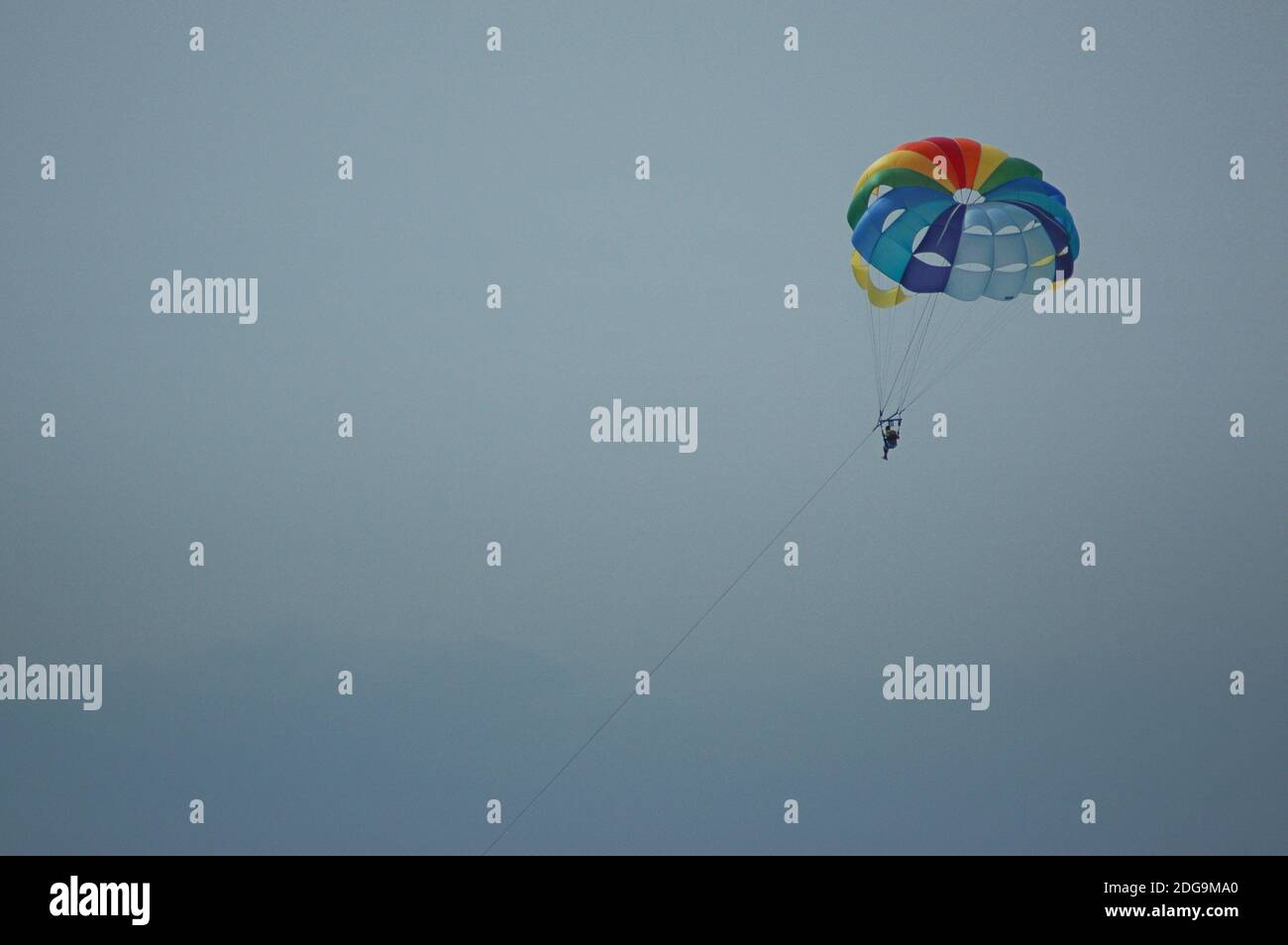 Recreational activity known as parascending or parasailing enjoyed by ...