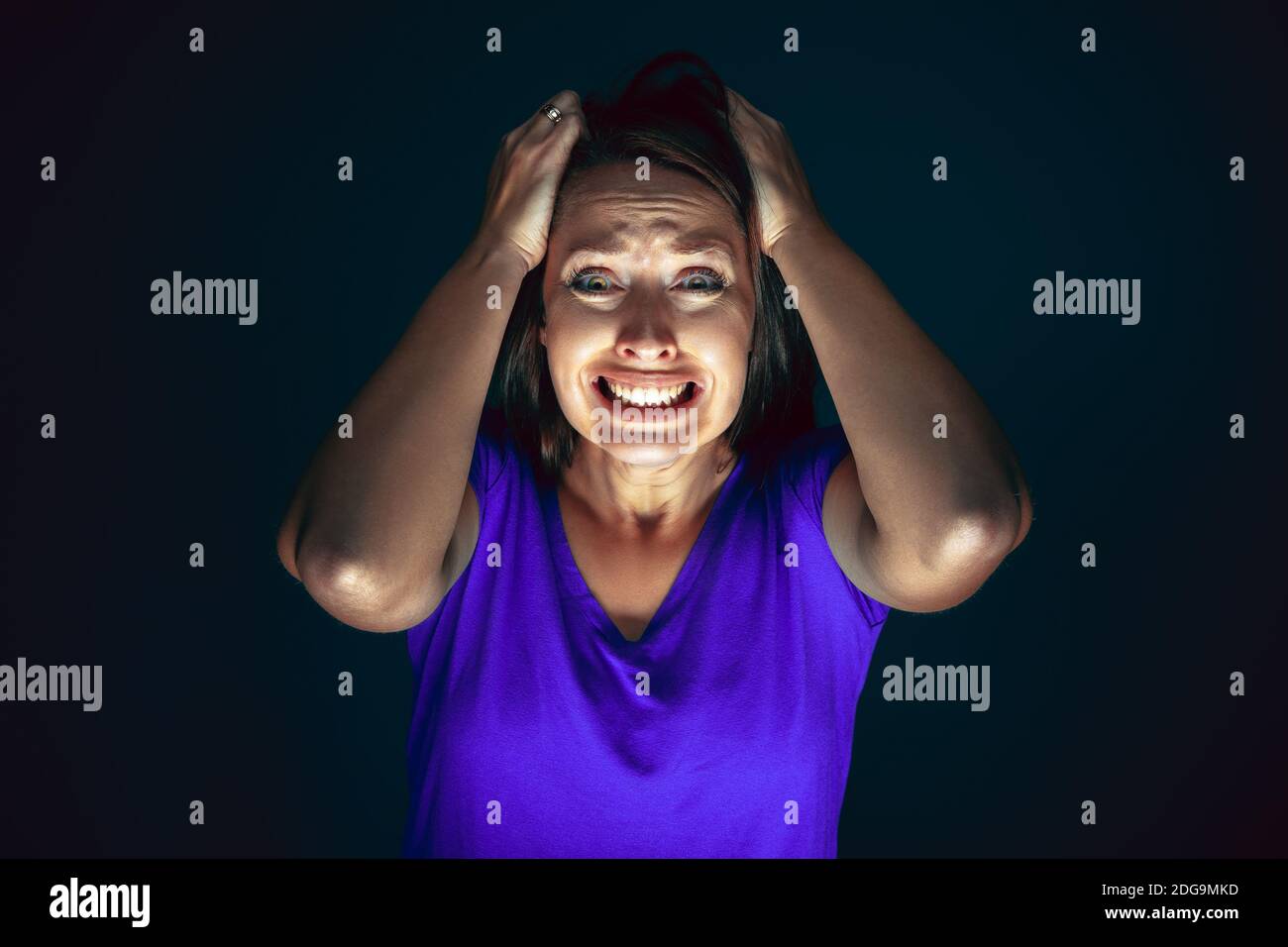 Spooky. Portrait of young crazy scared and shocked caucasian woman ...