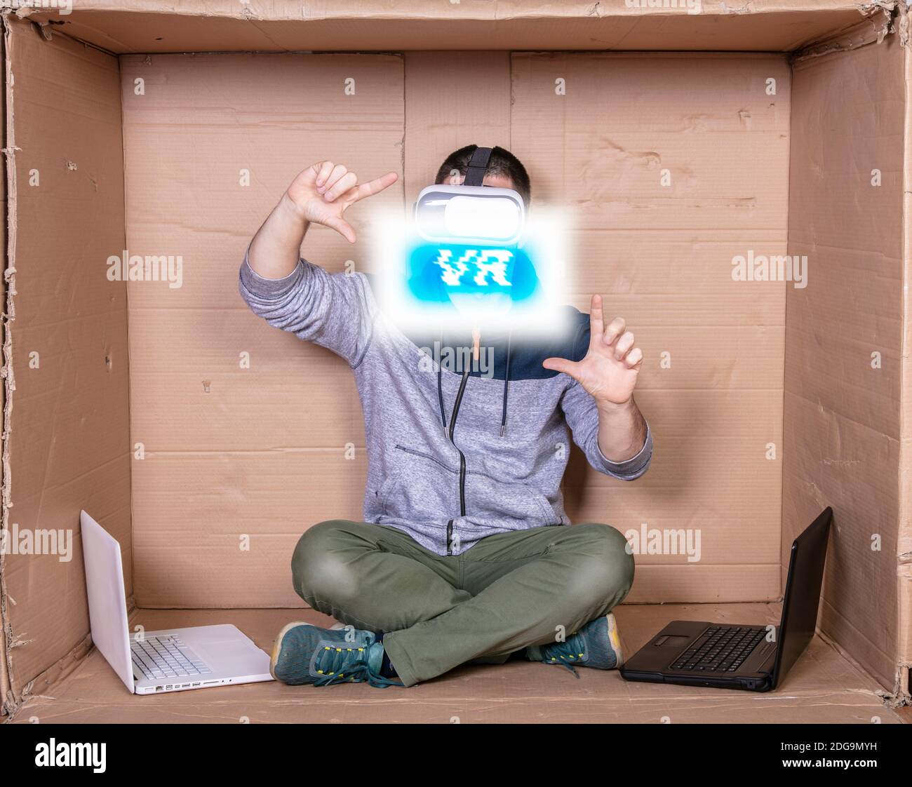 worker wearing VR glasses shows the VR sign between his hands Stock ...