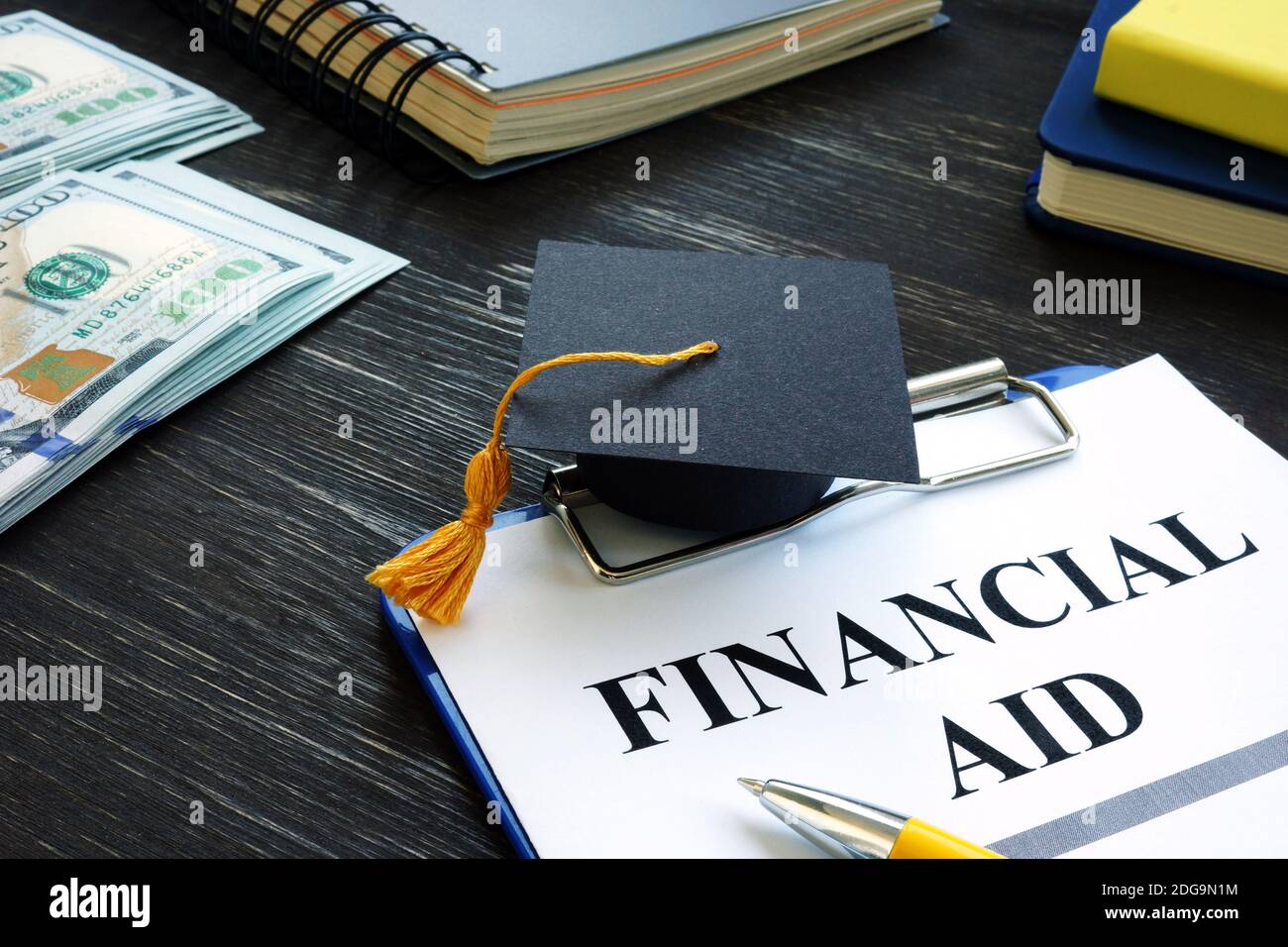 Graduation cap and financial aid for student form on the desk Stock ...