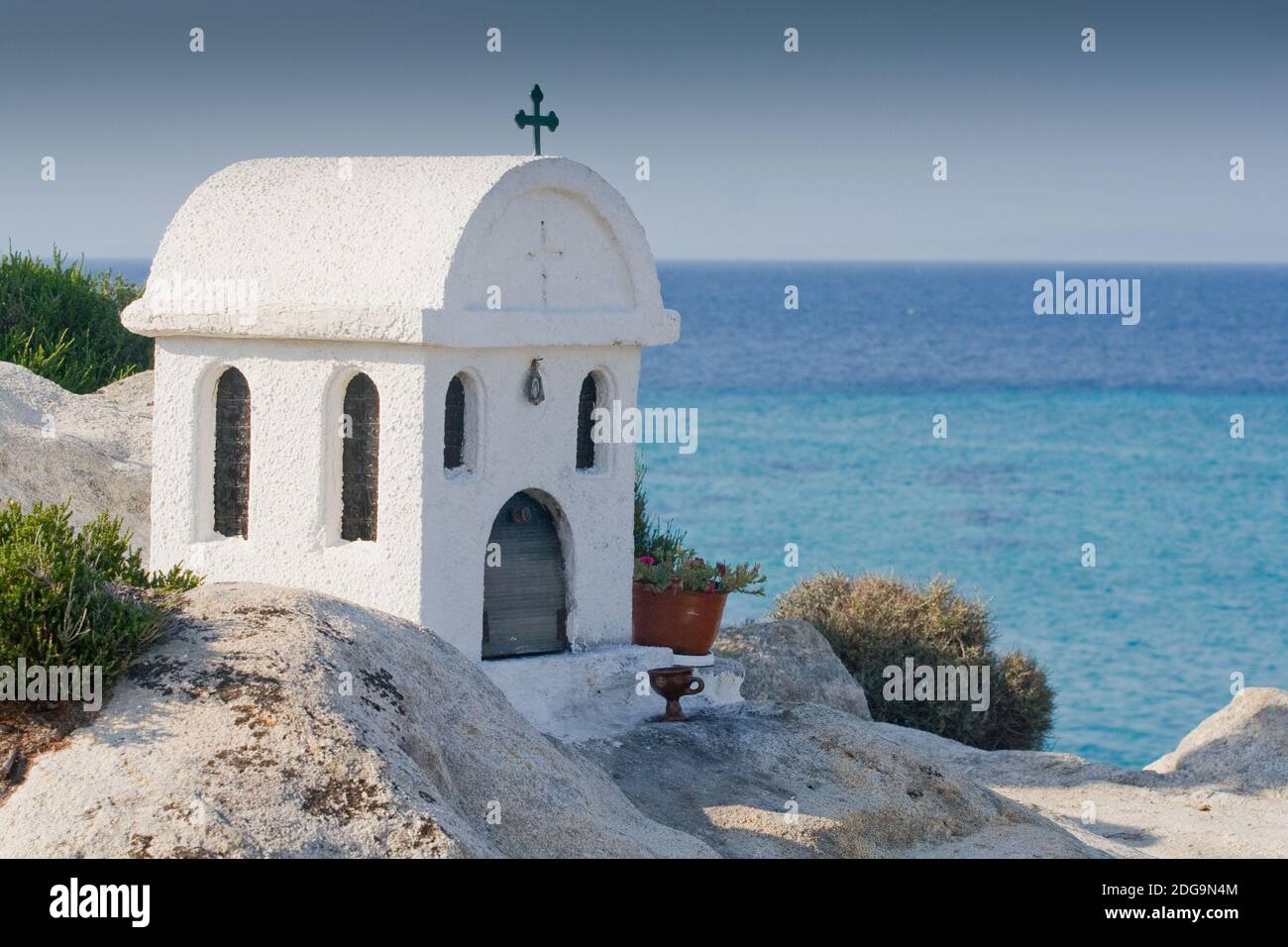 Small Greek chapel with blue sky Stock Photo - Alamy