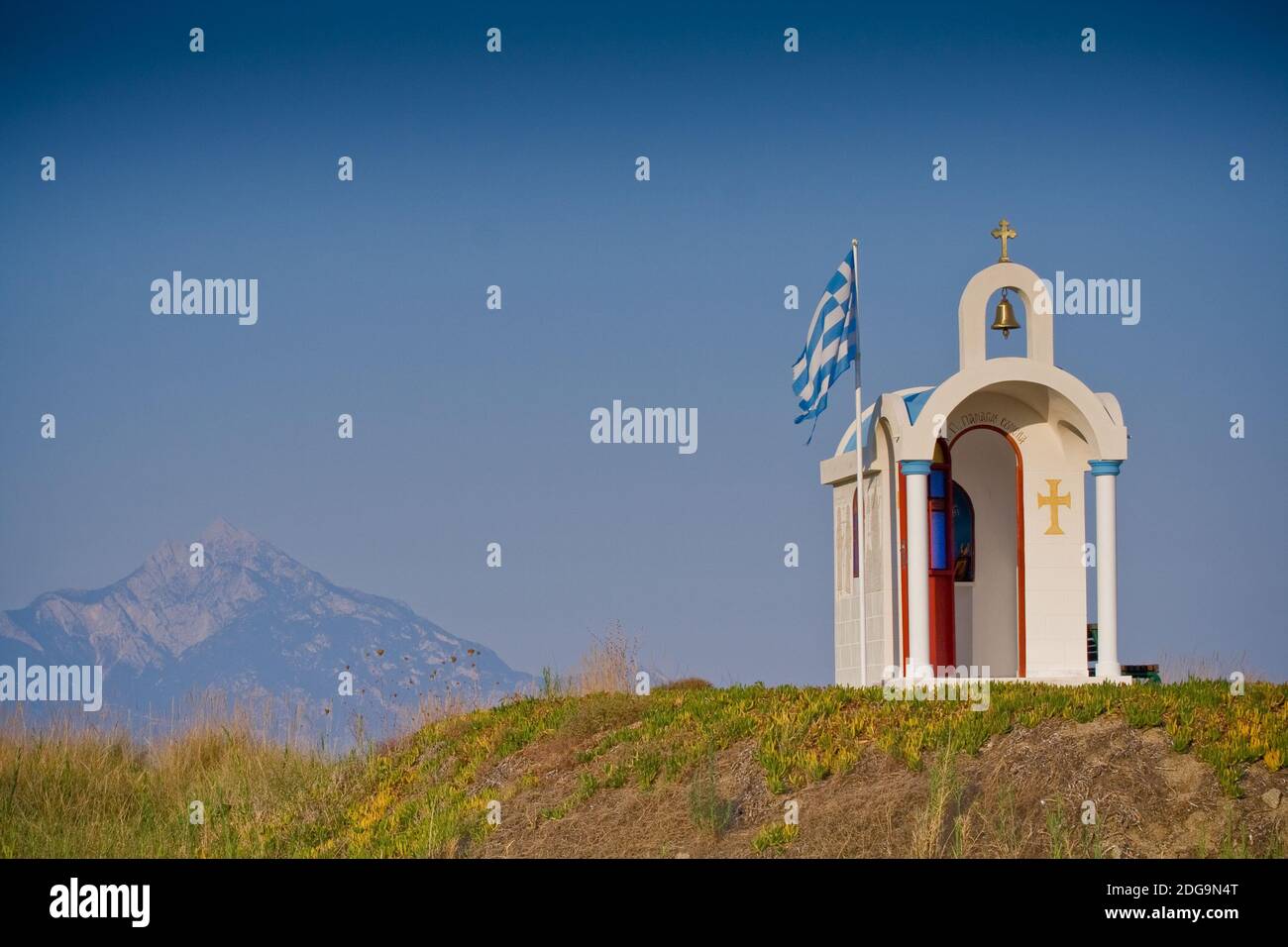 Small Greek chapel with blue sky Stock Photo - Alamy