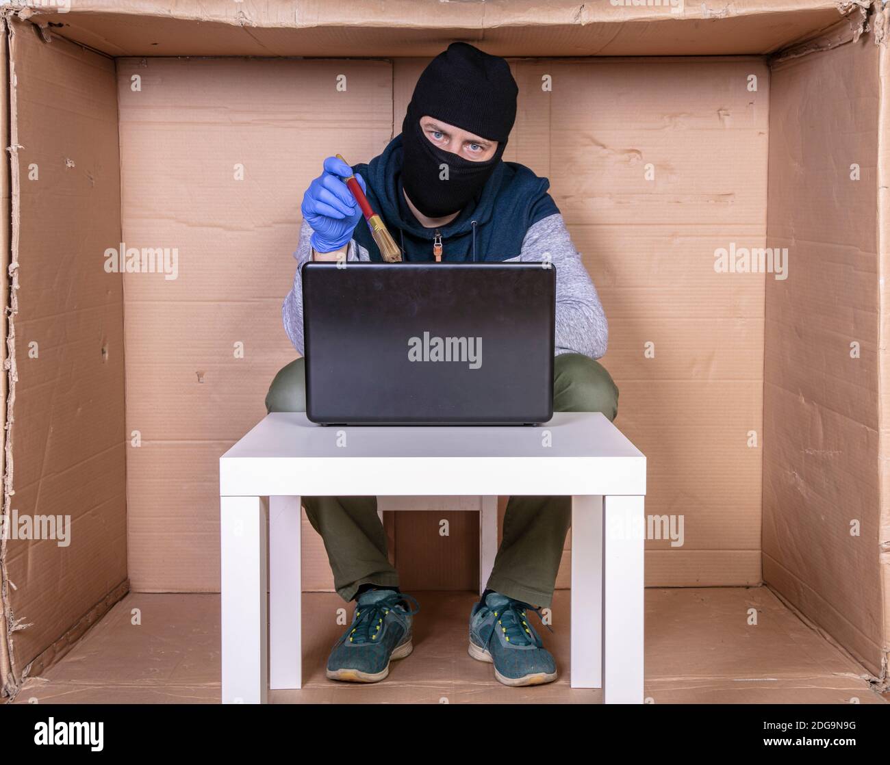 internet scammer works hard on computer Stock Photo - Alamy