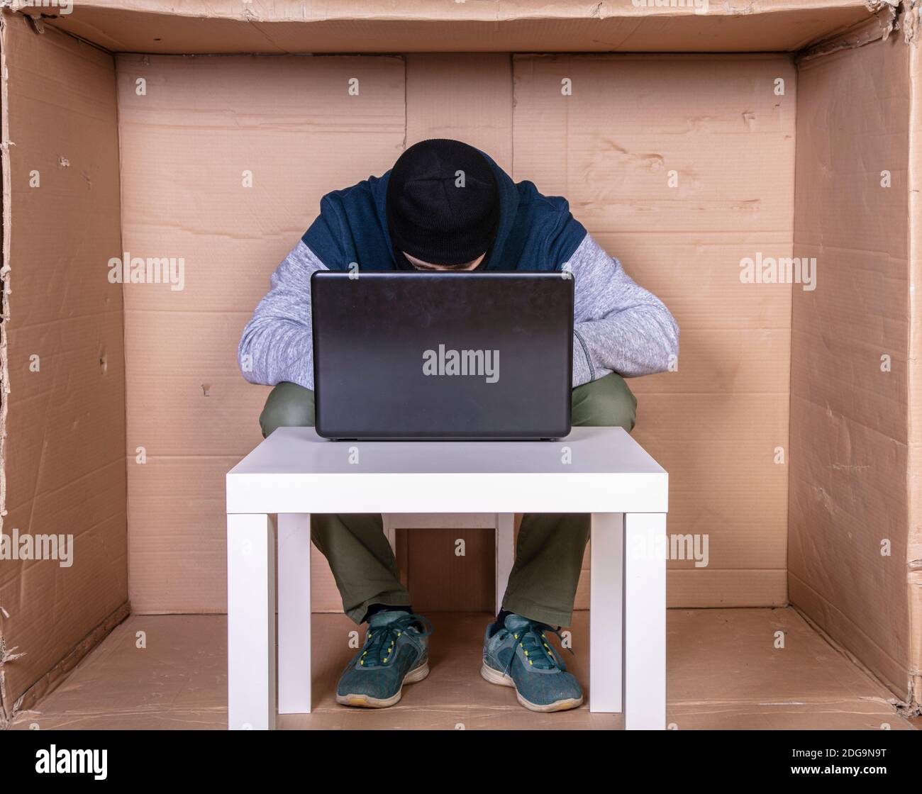 internet scammer works hard on computer Stock Photo - Alamy