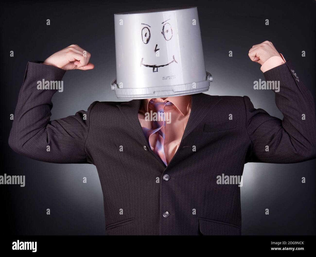 funny businessman with a bucket on his head Stock Photo - Alamy