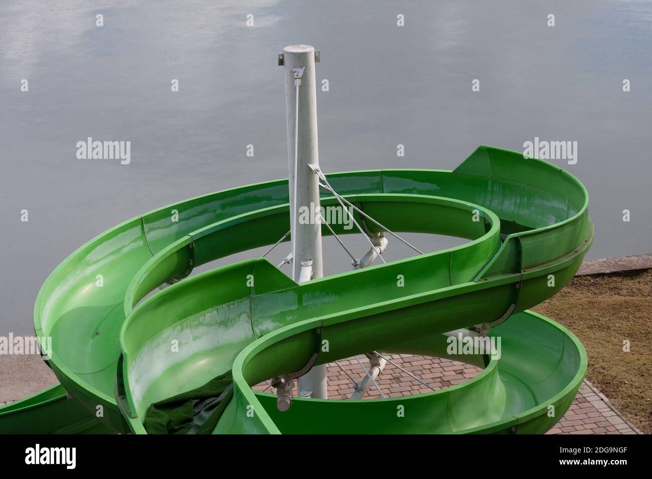 a green waterslide with lake Stock Photo - Alamy