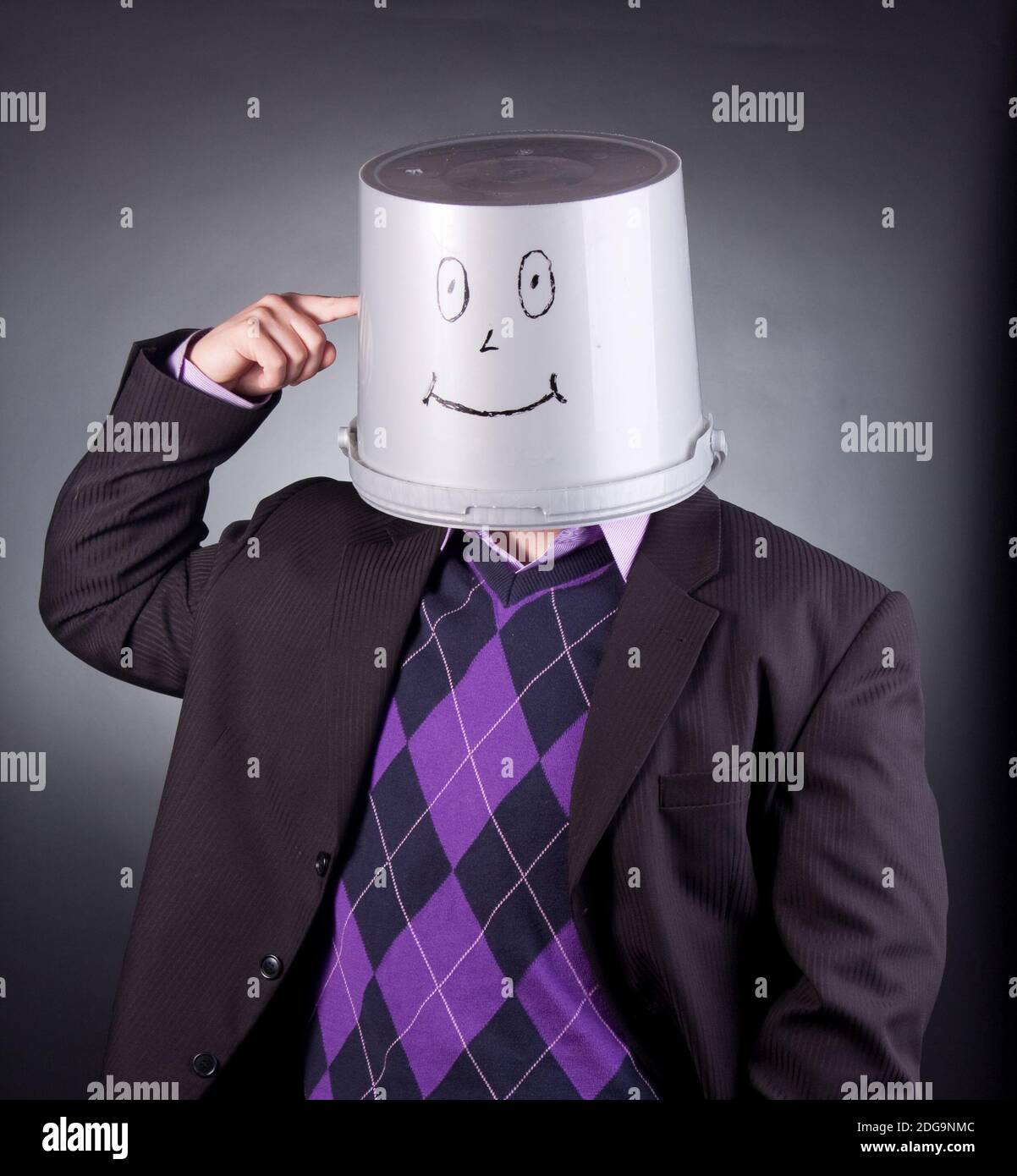 funny businessman with a bucket on his head Stock Photo - Alamy