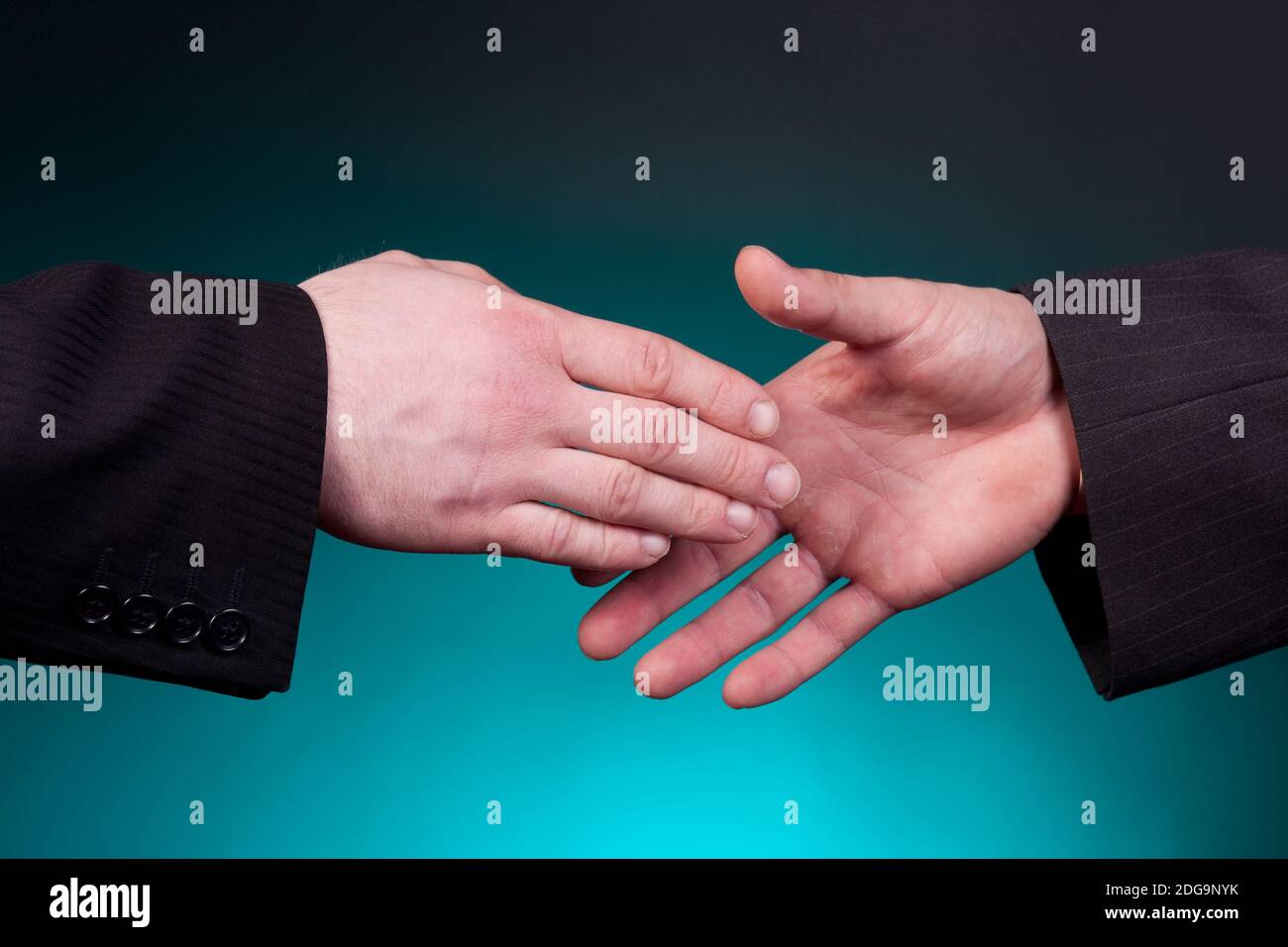 two elegant businessman shaking hands Stock Photo - Alamy