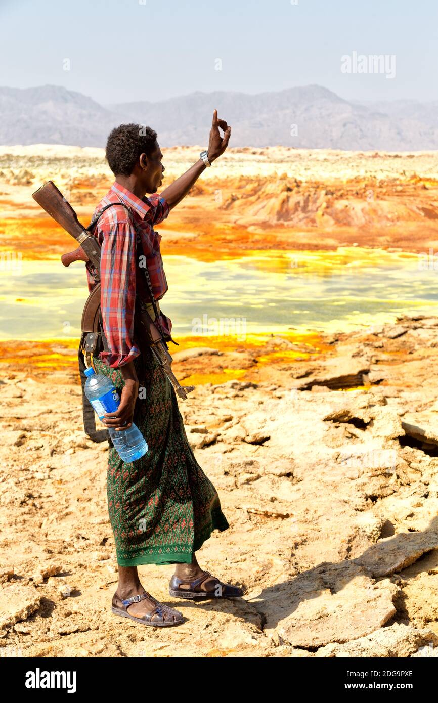 A black soldier and his gun looking the boarder Stock Photo - Alamy