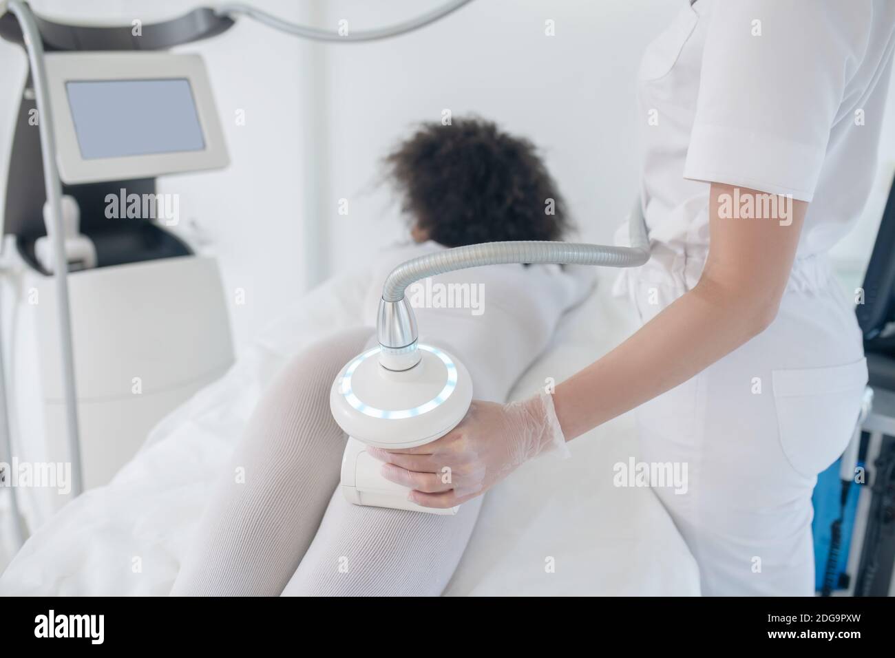 Doctor and patient during body correction procedure Stock Photo - Alamy