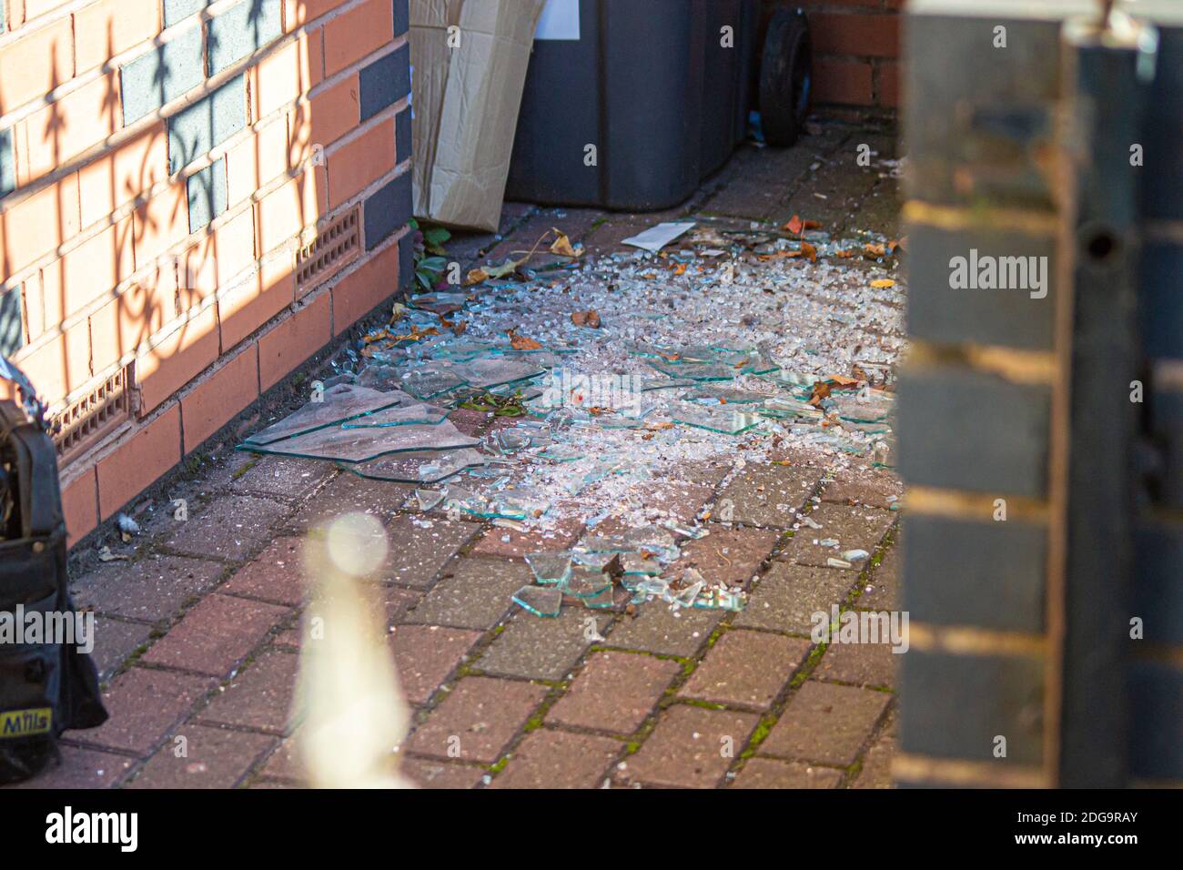 Smashed glass from window, on brickwork Stock Photo - Alamy