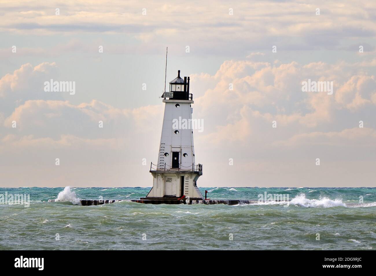 Lighthouse on a windy overcast day in Ludington Michigan Stock Photo ...