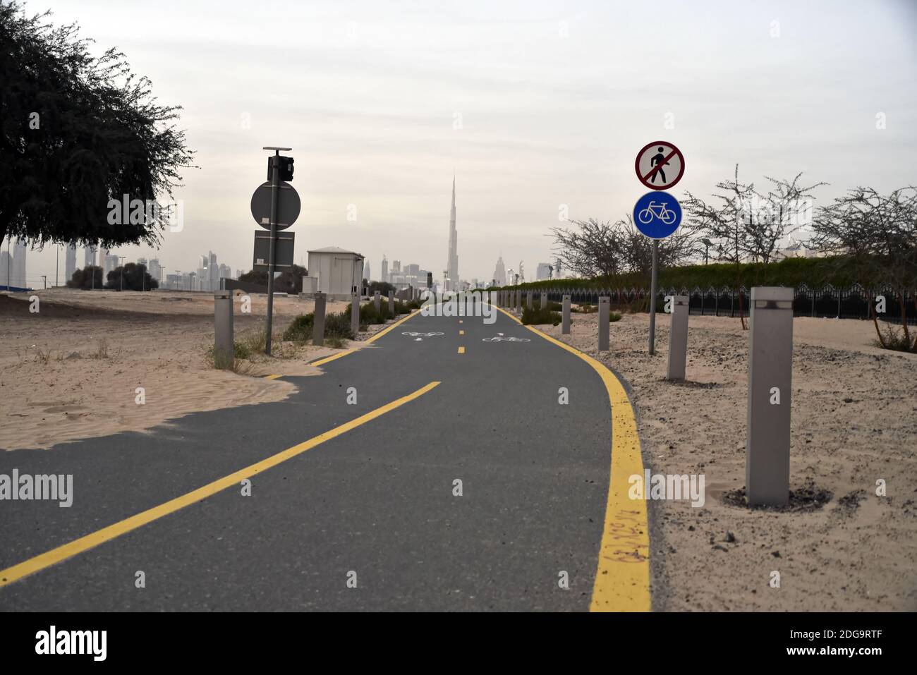 The Nad Al Sheba bicycle track road surrounded by sands in Dubai ...