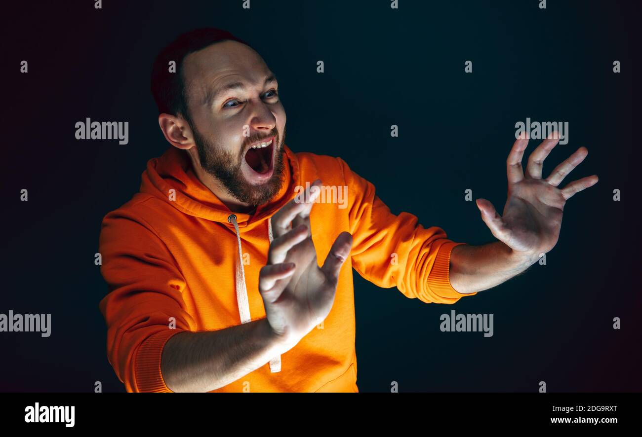 Spooky. Portrait of crazy scared and shocked caucasian man isolated on ...