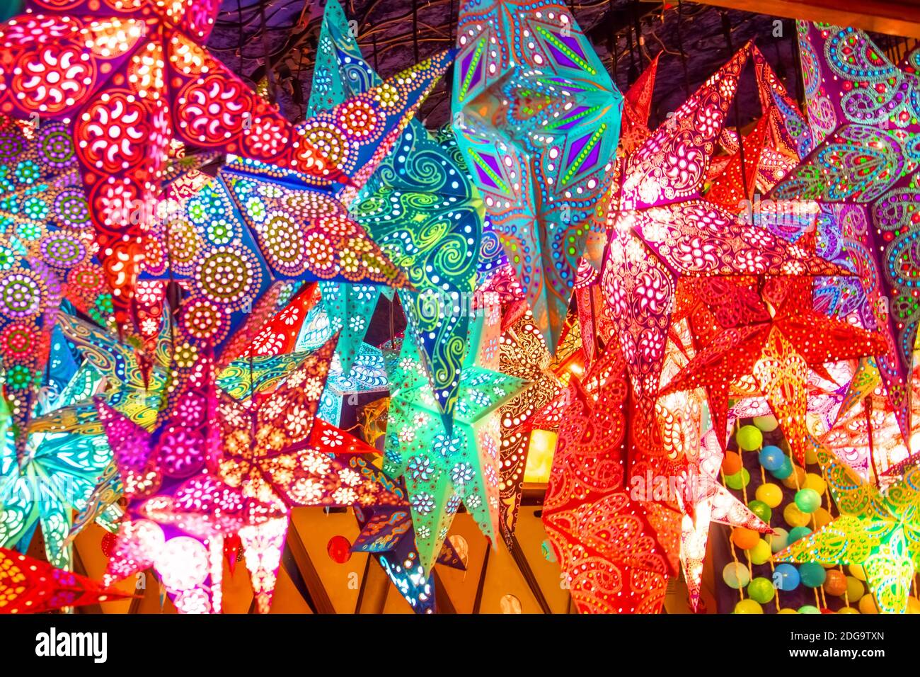 Paper bright multi-colored stars on christmas sale and New Year stars ...