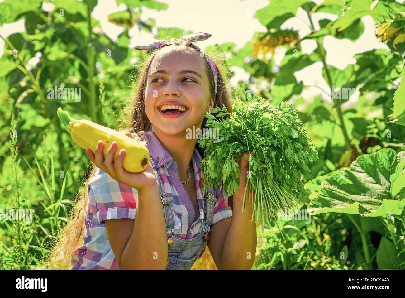 childhood happiness. portrait of happy kid with vegetable marrow ...
