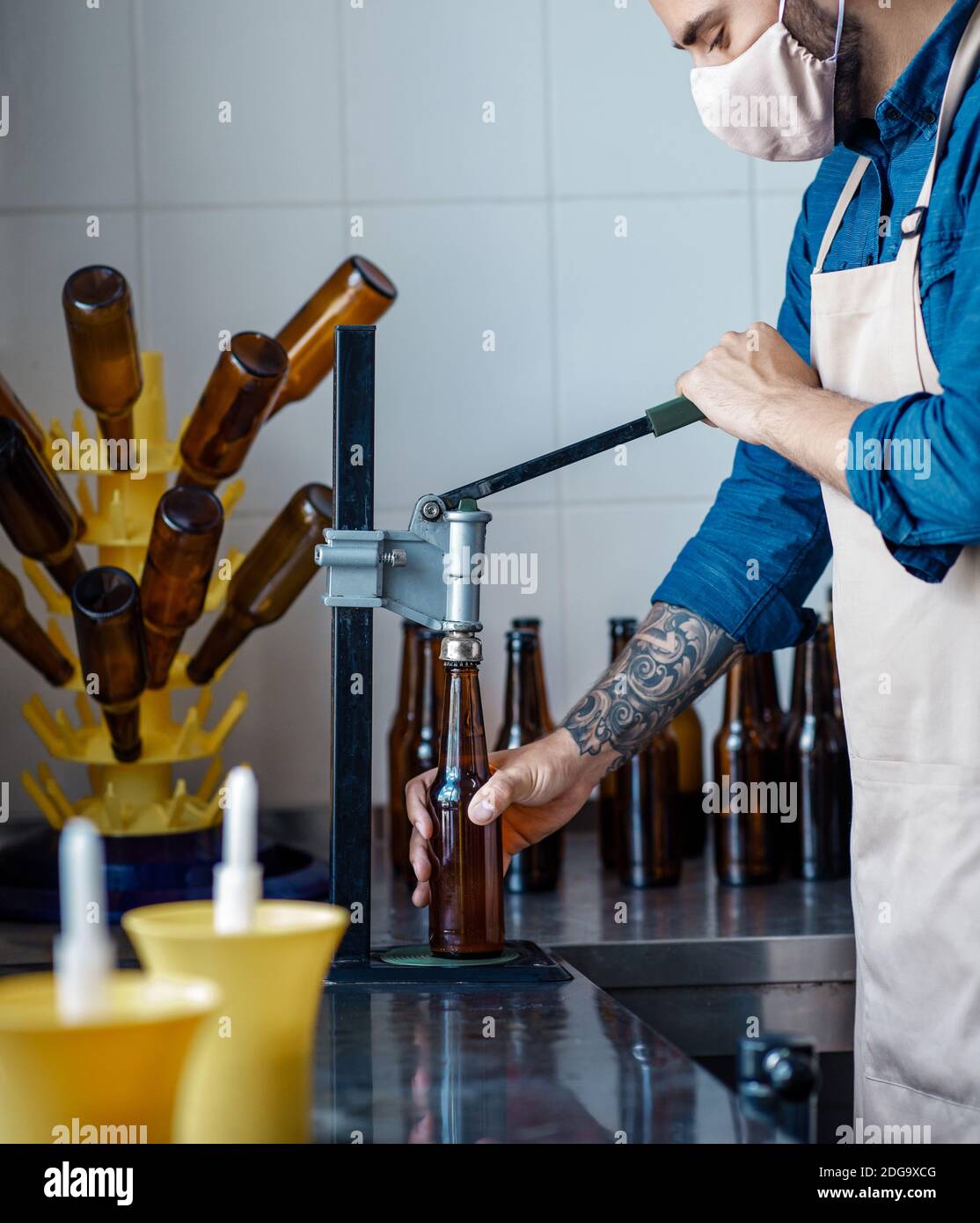 Beer packaging, brewery and factory work. Young attractive worker in ...
