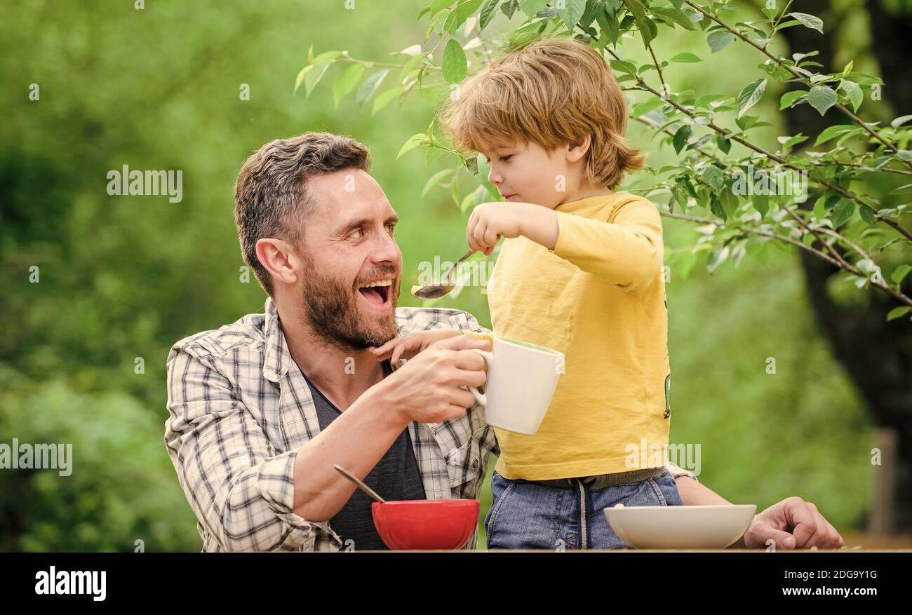 Father son eat food and have fun. Feeding baby. Menu for children ...
