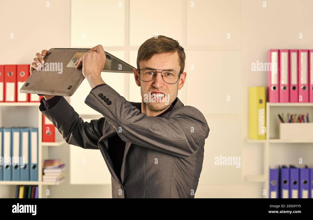 Mad man throwing away laptop online job, hateful job concept Stock ...