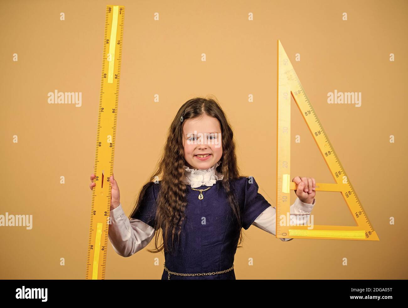 Smart and clever concept. Sizing and measuring. Pupil cute girl with ...