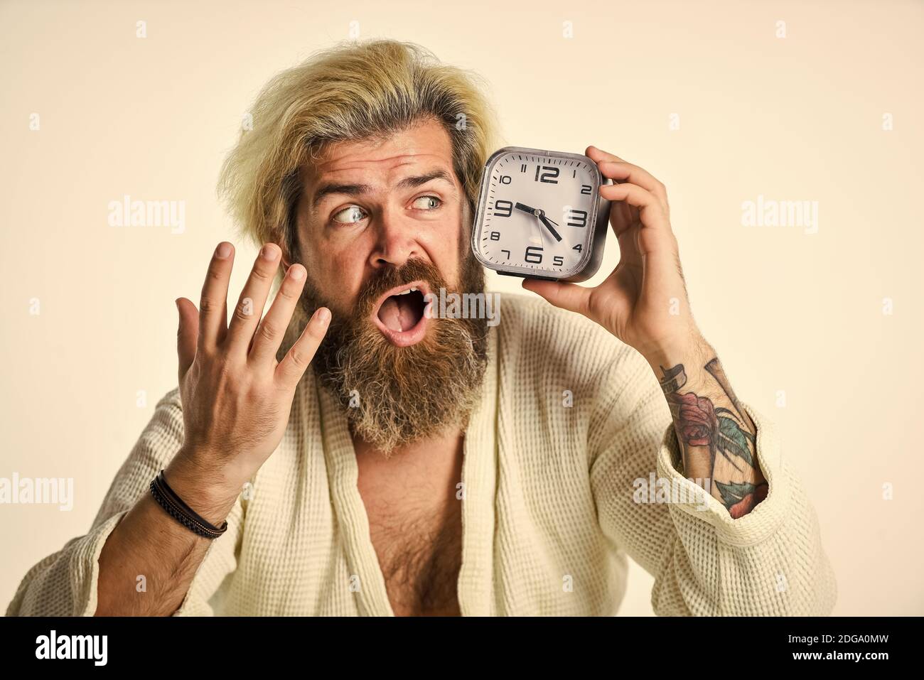 Lateness concept. Tired man in the bed not happy. suffering insomnia ...