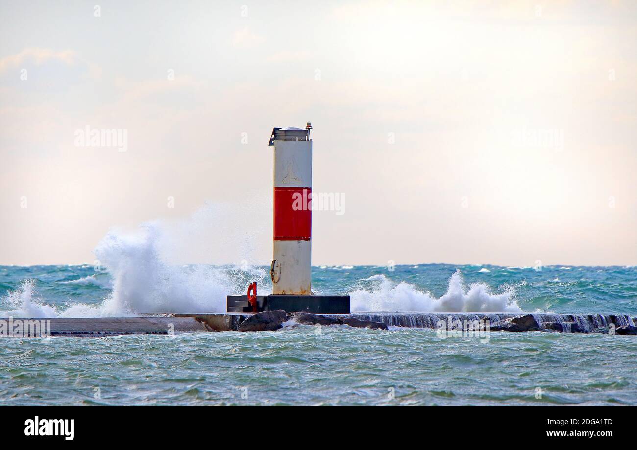 Breakwater on a windy overcast day in Ludington Michigan Stock Photo ...