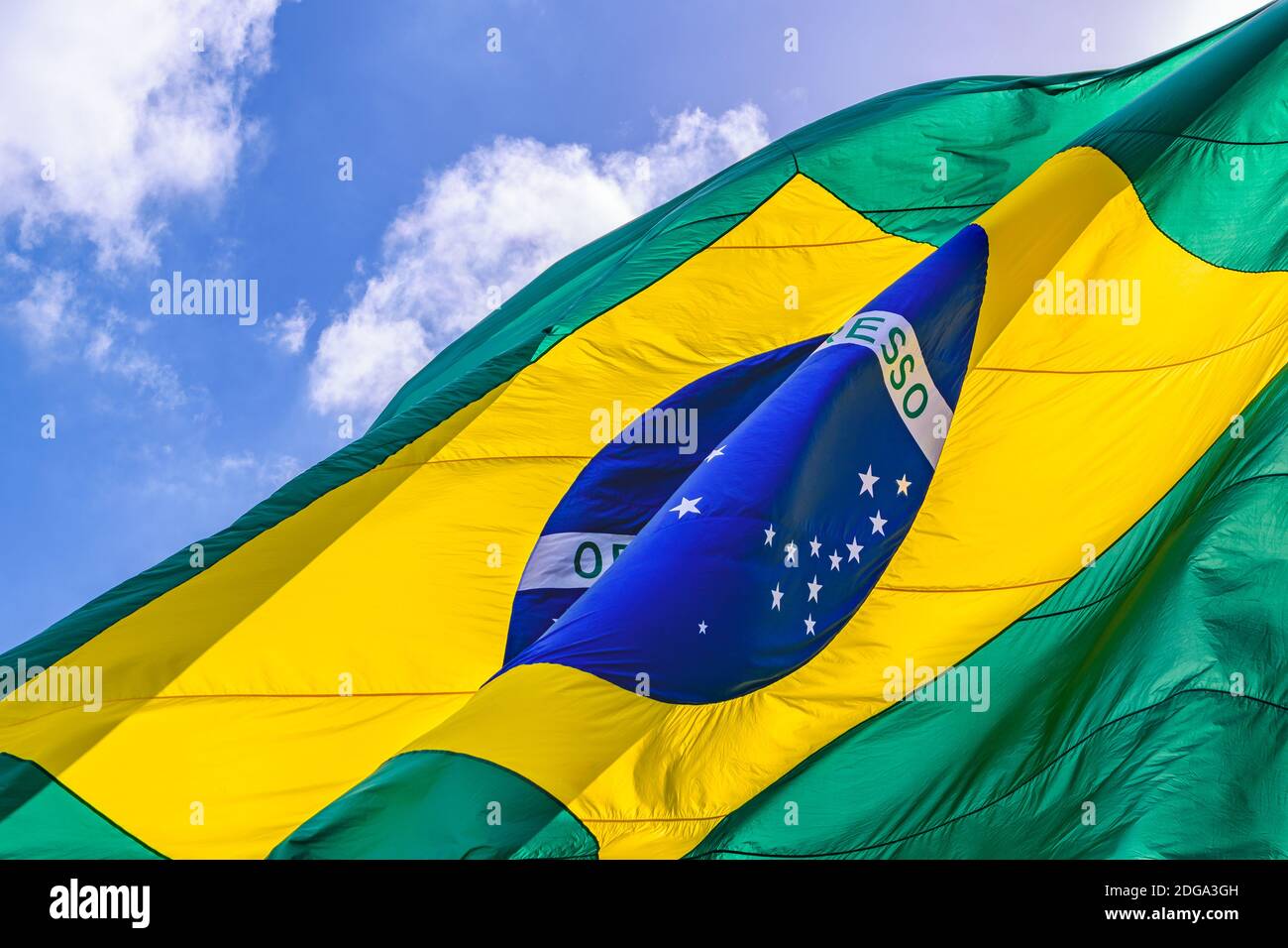 Brazilian Flag Waving Over Sky Stock Photo - Alamy