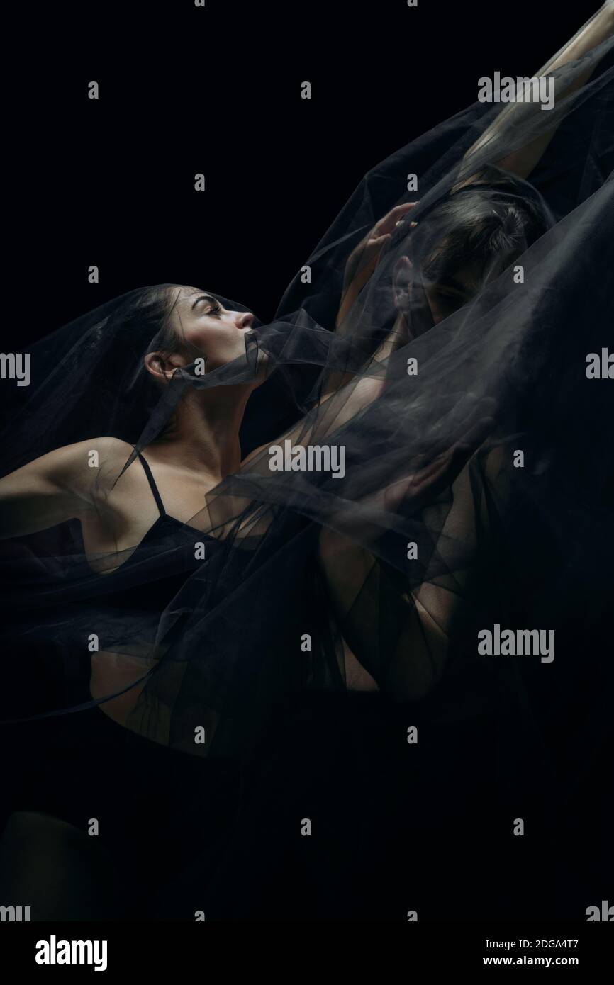 Passion. Graceful classic ballet dancers isolated on black studio ...