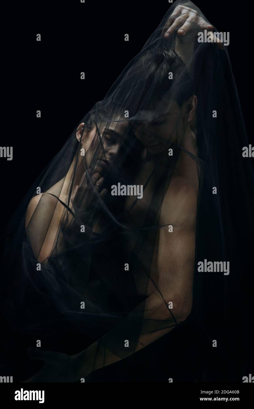 Skin. Graceful classic ballet dancers isolated on black studio ...