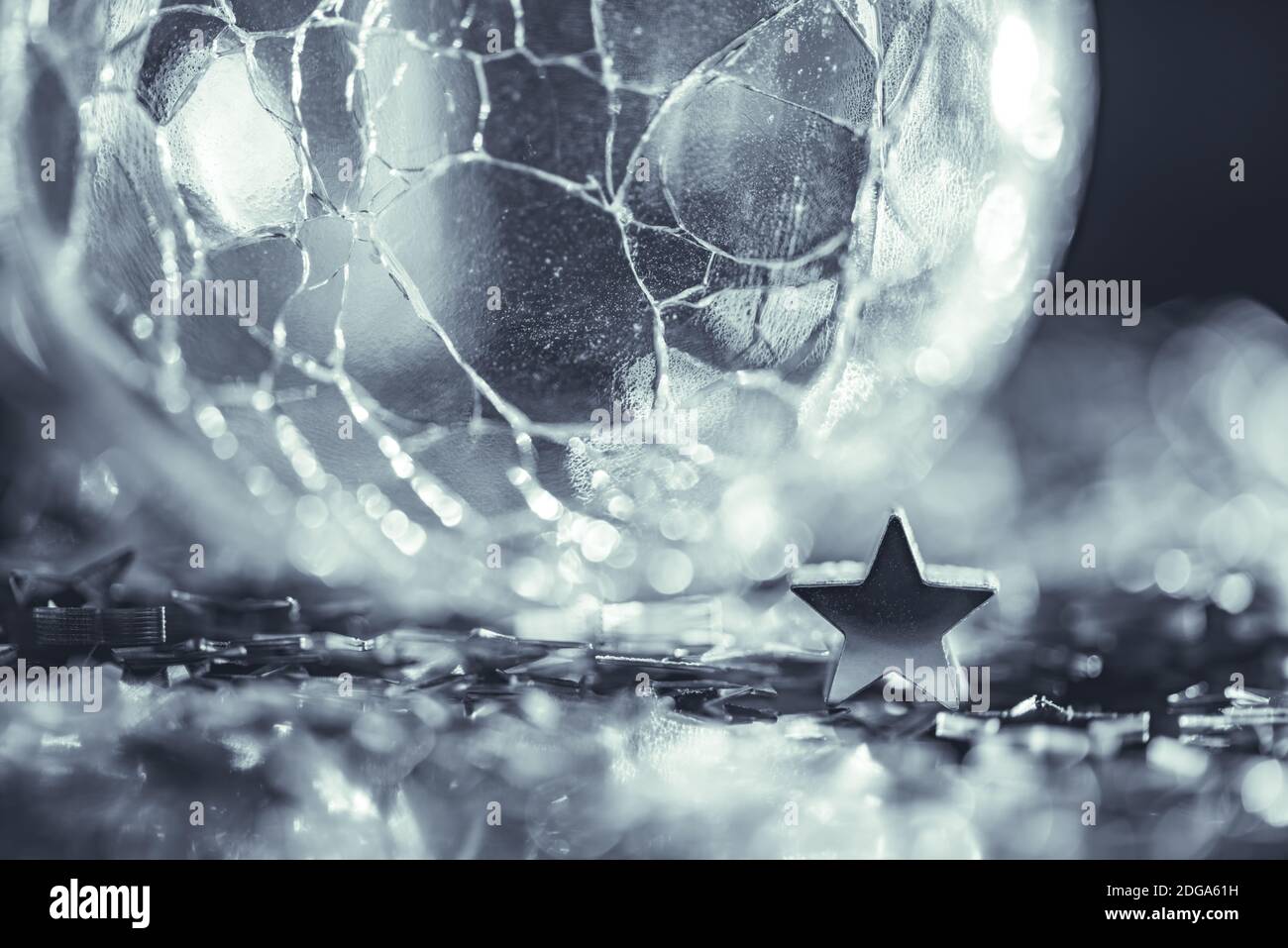 Macro photo of cracked glass sphere silver star with light bokeh Stock ...