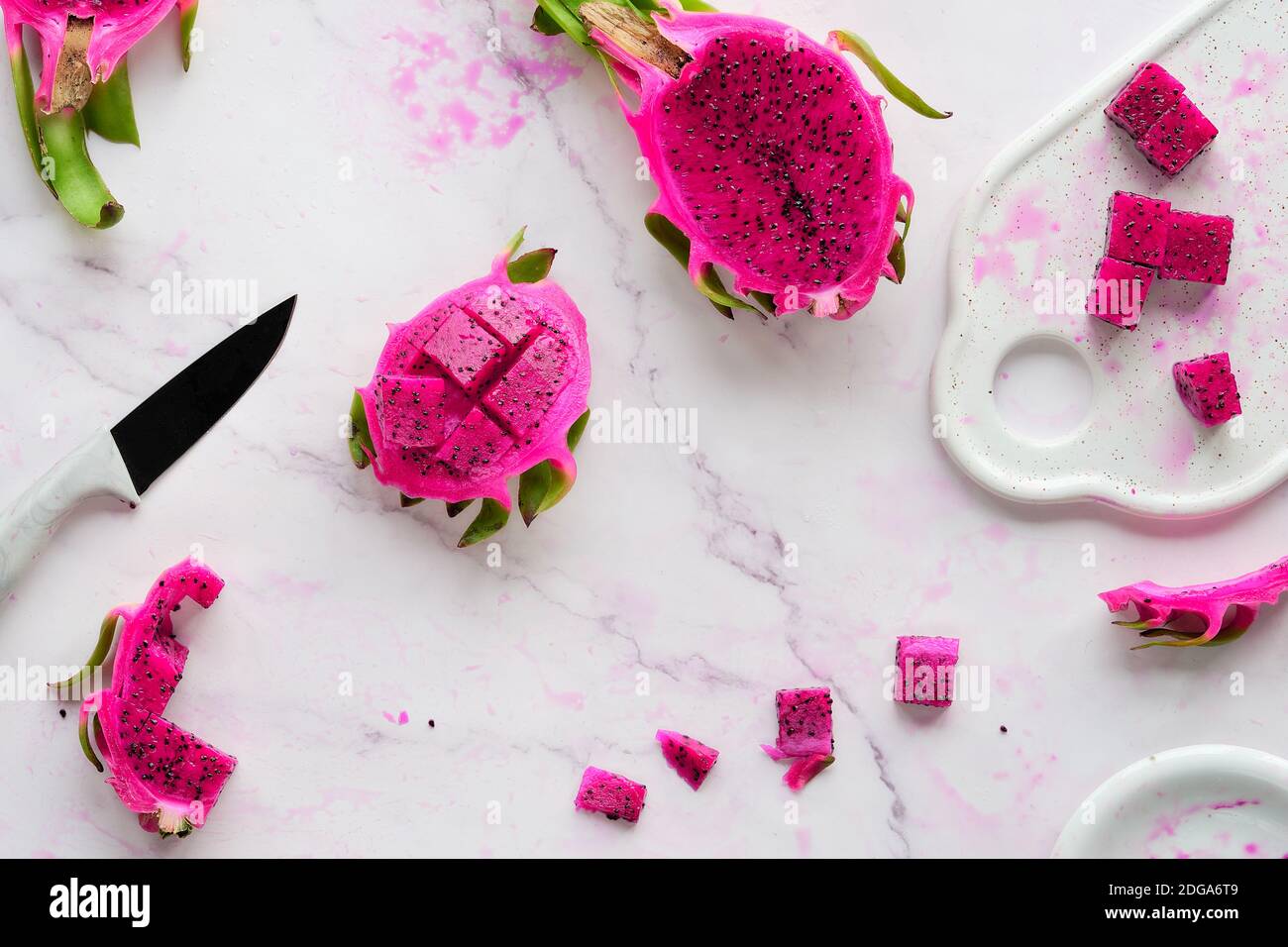 Ugly food. Juicy pink dragon fruit, pitaya, pitahaya sliced on marble ...