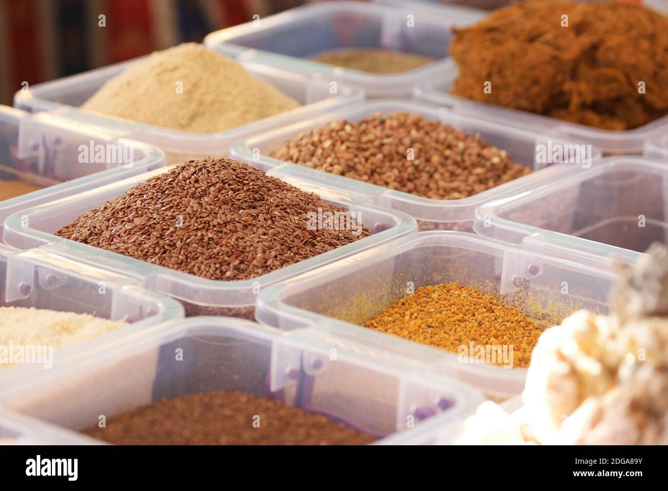 Flax seeds and other healthy seasonings in plastic boxes Stock Photo ...