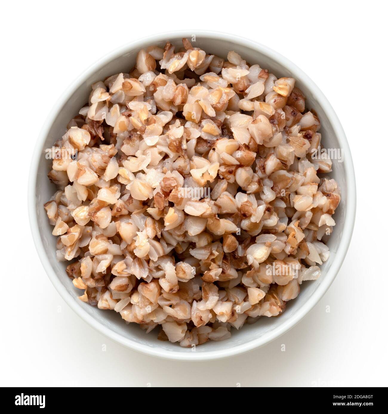 Cooked toasted buckwheat in a white ceramic bowl isolated on white. Top ...