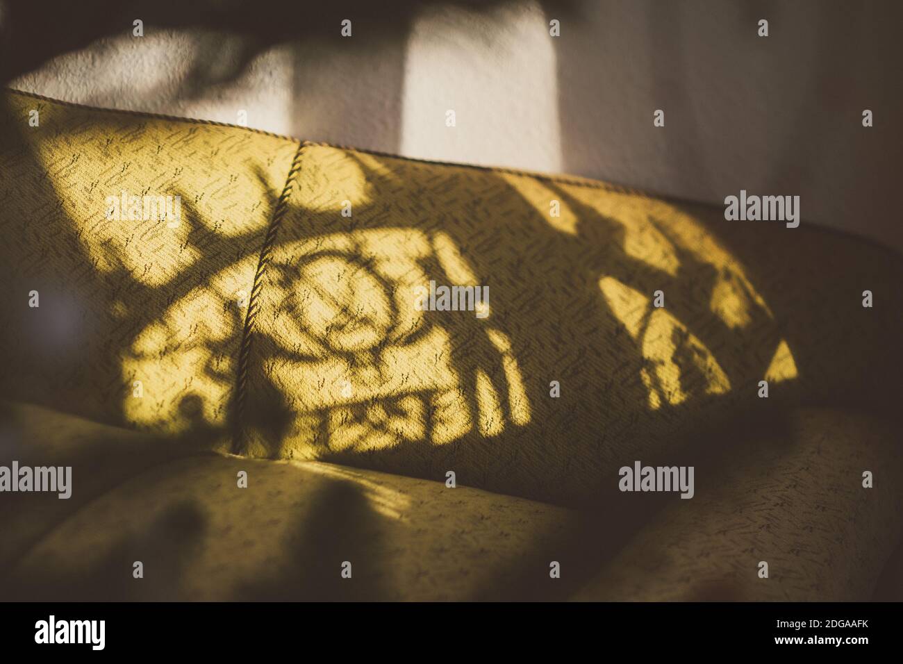 The shadow of candle arch on couch Stock Photo - Alamy