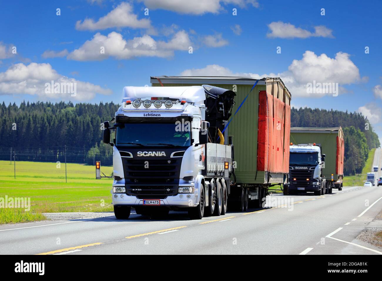 Two silver Scania trucks Nosto ja Kuljetus S. Lehtinen Oy haul portable ...