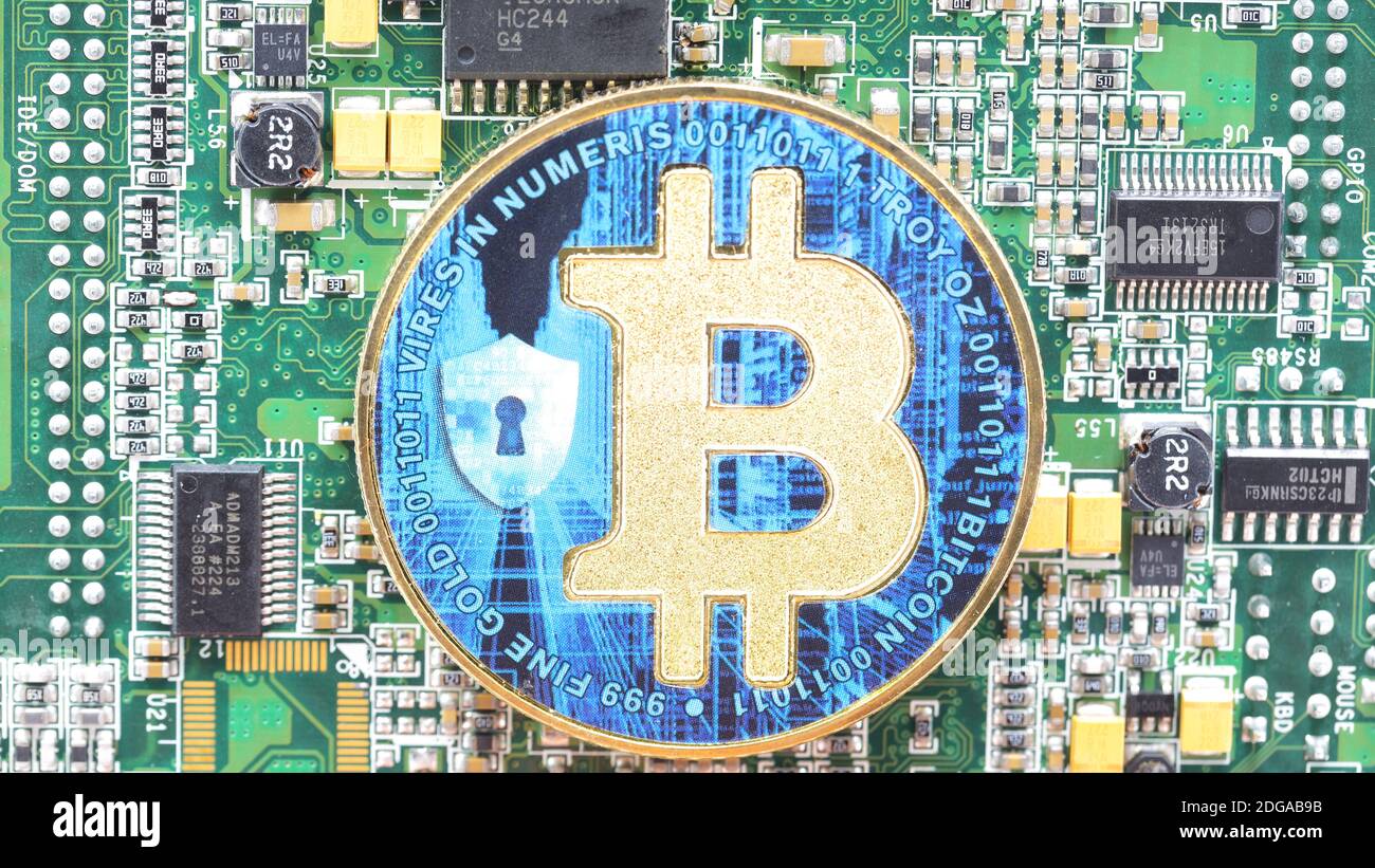 Motherboard of a computer the coin of bitcoin Stock Photo - Alamy
